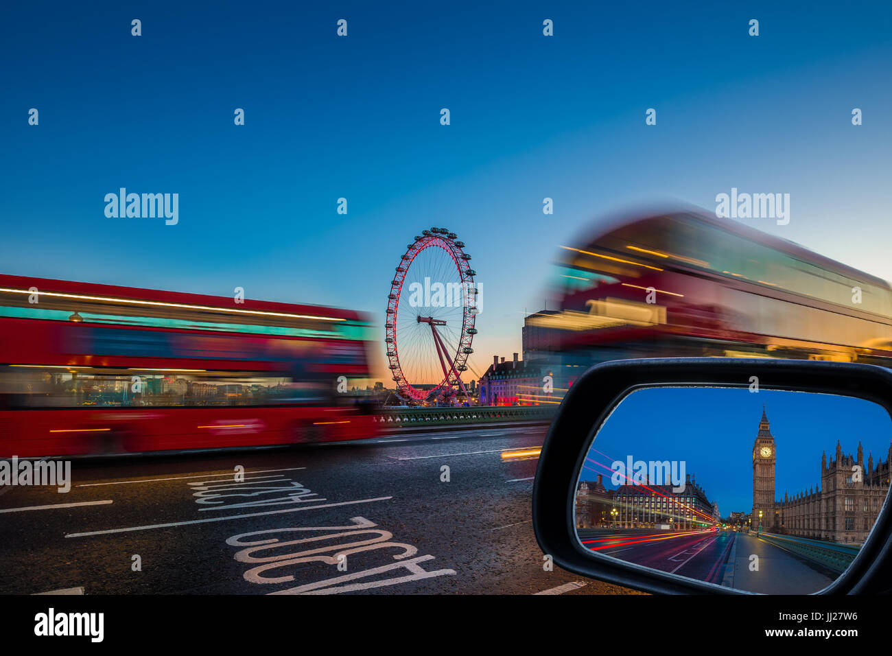 London, England - Traditional red double decker buses on the move on ...