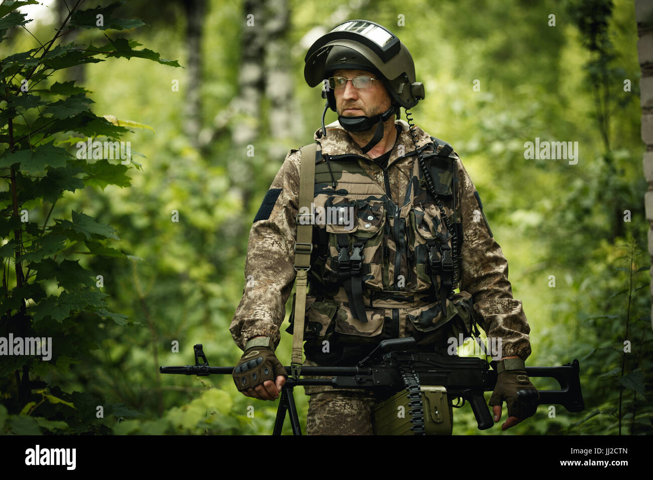 Strikeball player with weapon ,helmet Stock Photo - Alamy