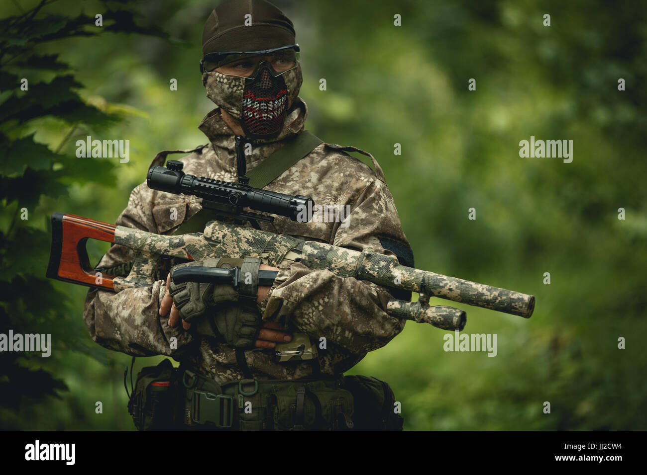 Strikeball player in camouflage,helmet Stock Photo - Alamy