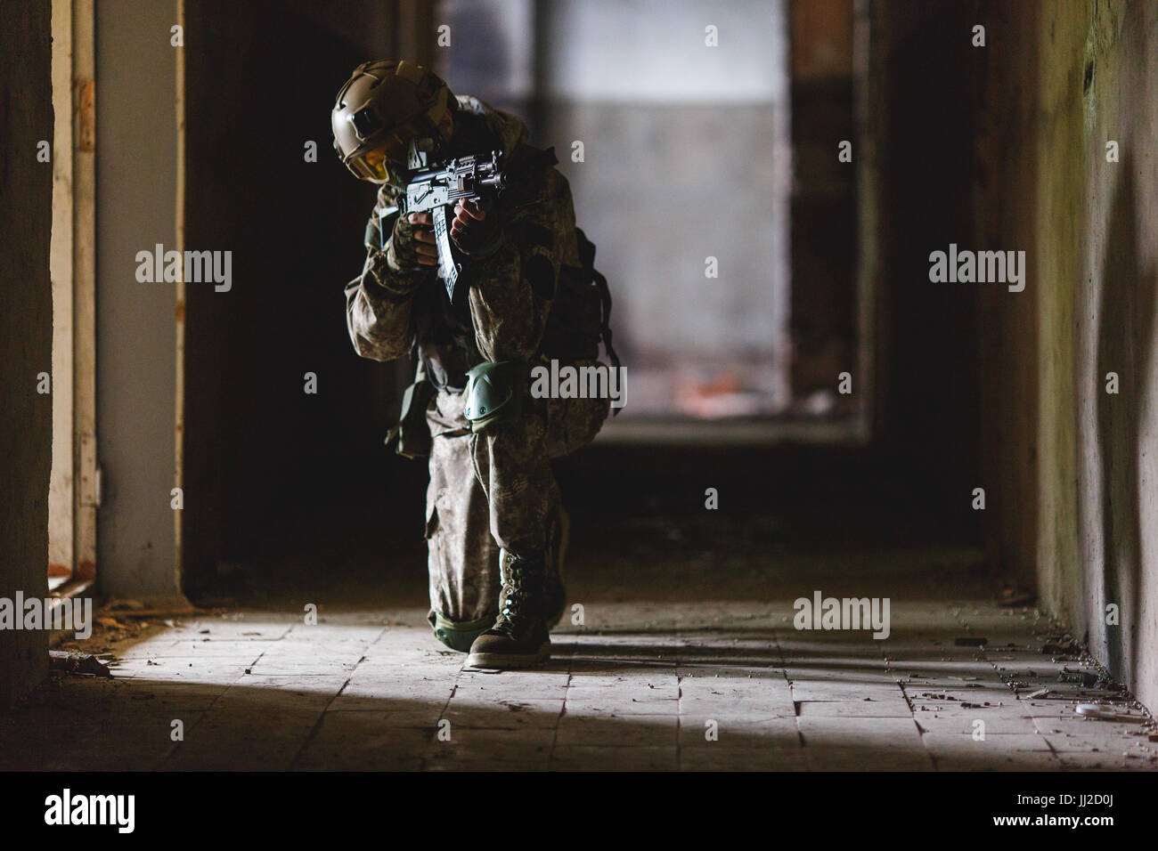 Soldier on assignment with gun Stock Photo - Alamy