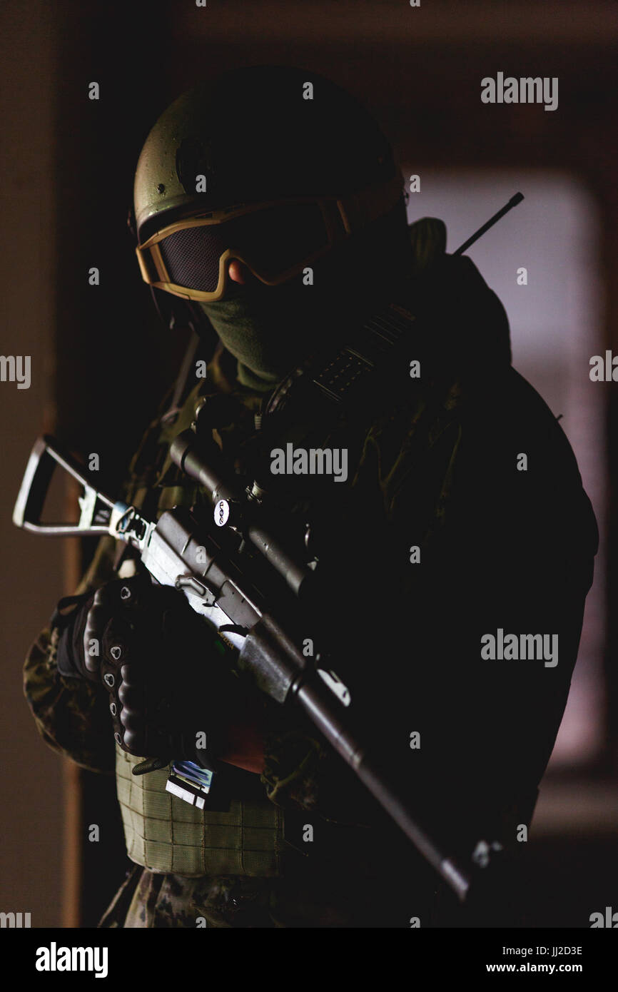 Strikeball player with machine gun Stock Photo - Alamy