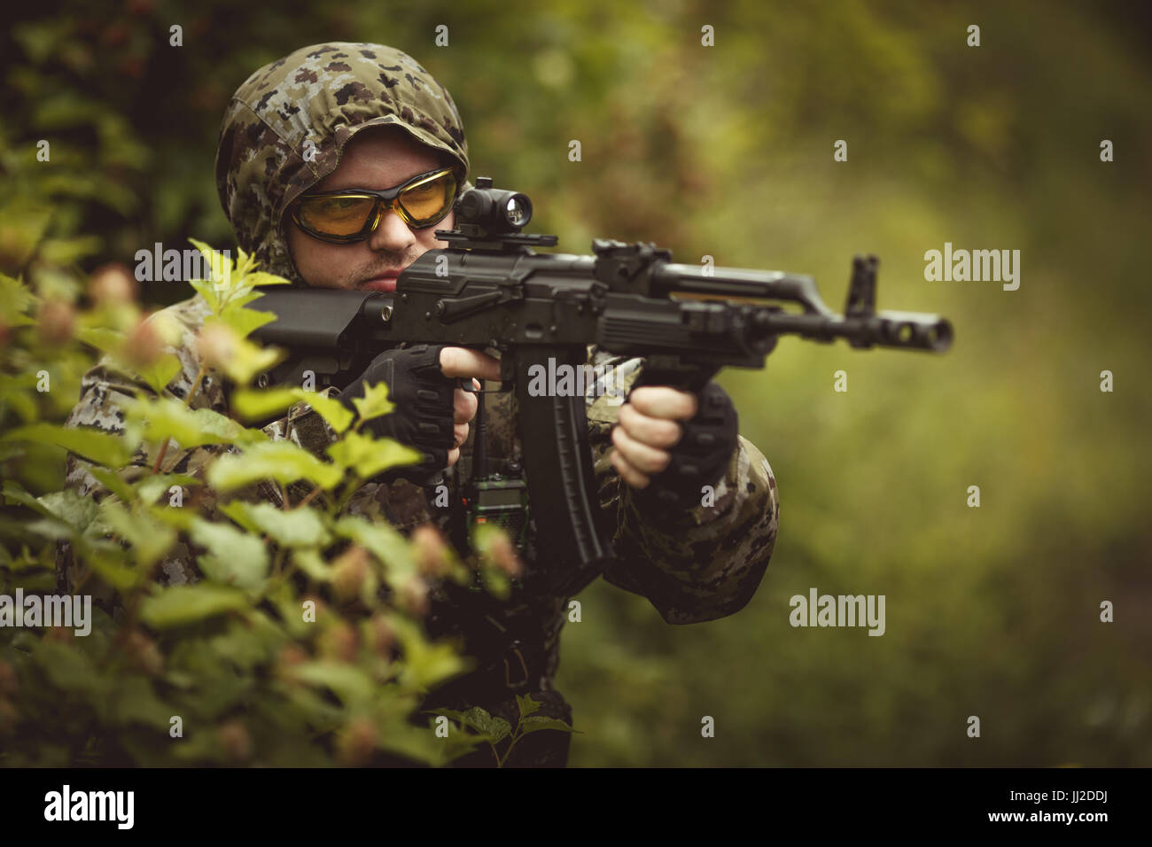 Portrait of soldier with submachine-gun Stock Photo - Alamy