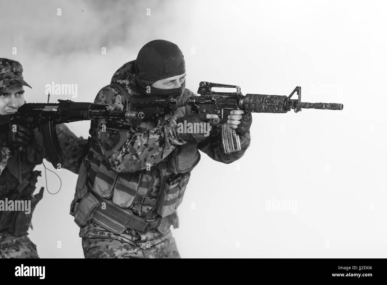 Strikeball players with automatic weapons Stock Photo - Alamy