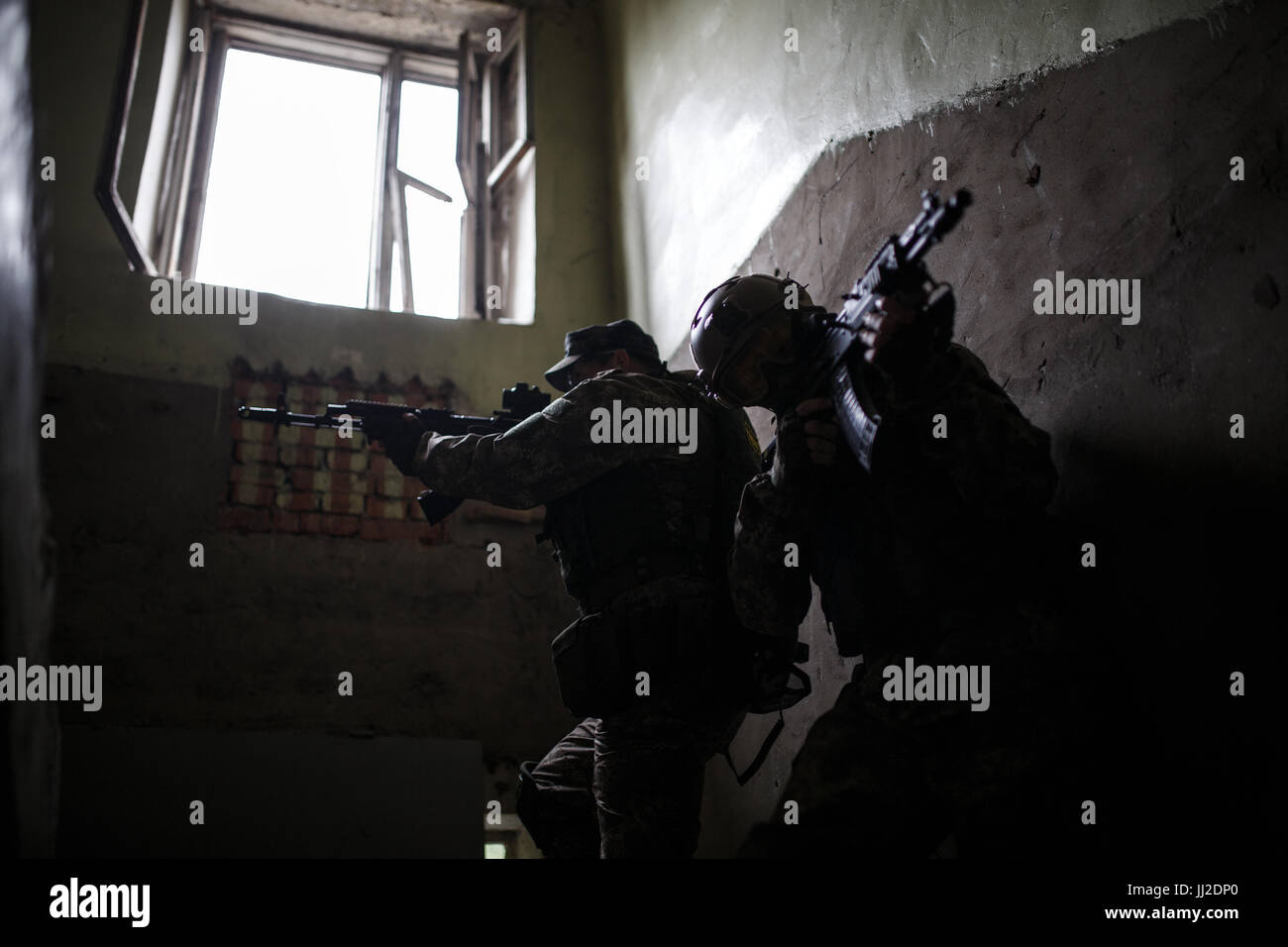 Photo of soldiers with weapons Stock Photo - Alamy