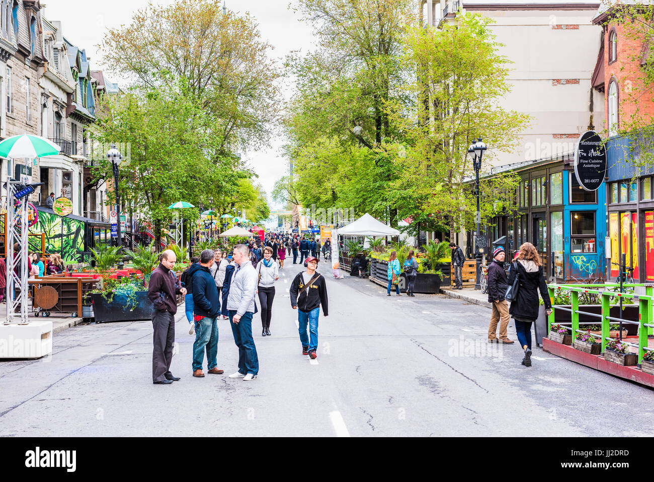 Montreal, Canada - May 26, 2017: People walking on Saint Denis street ...