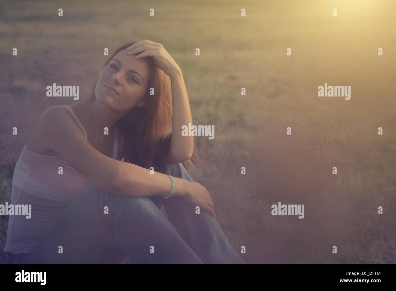Sad woman in summer sunset Stock Photo - Alamy