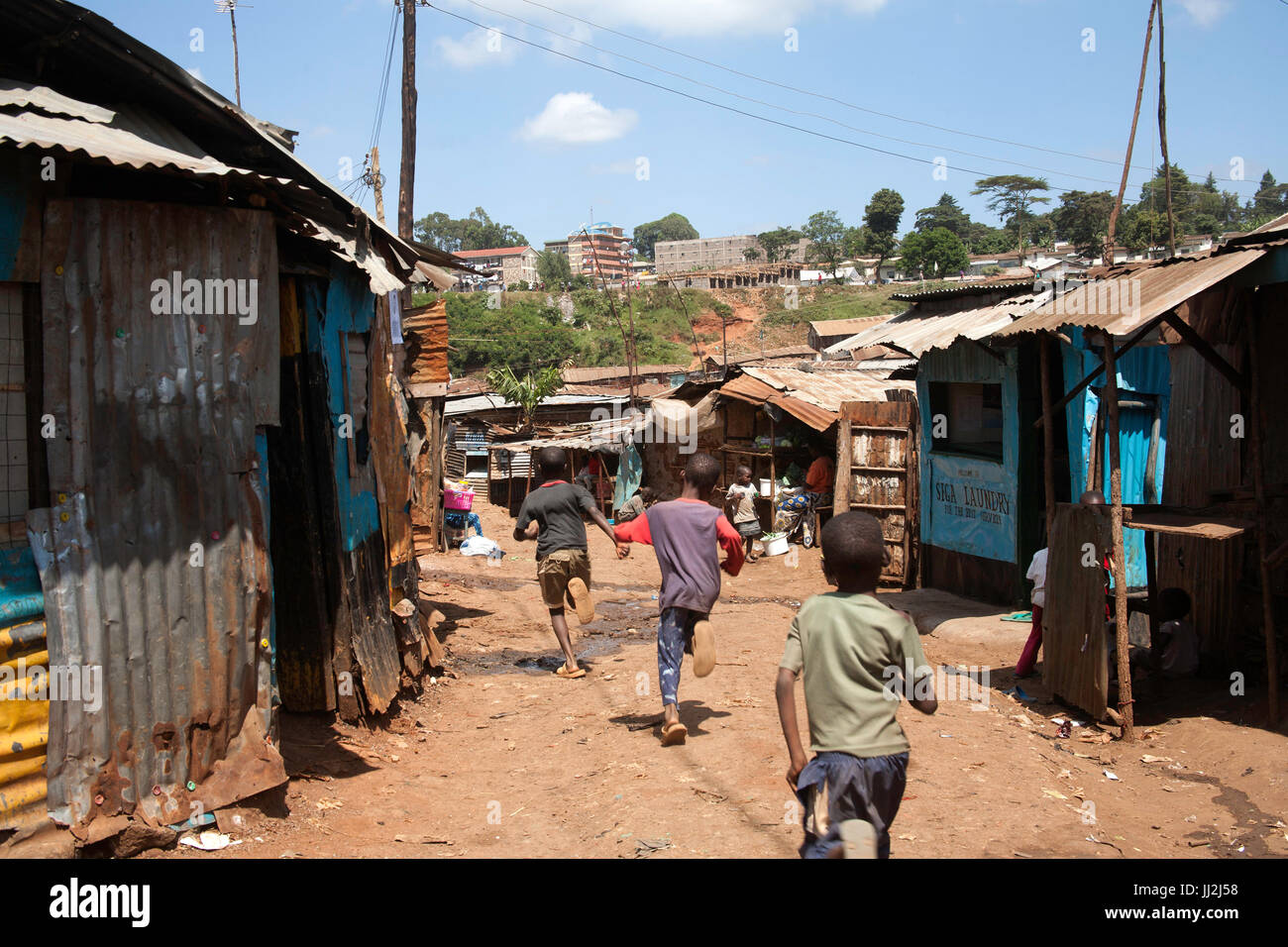 Kids running though the streets of Kibera slum, Nairobi, Kenya, East ...