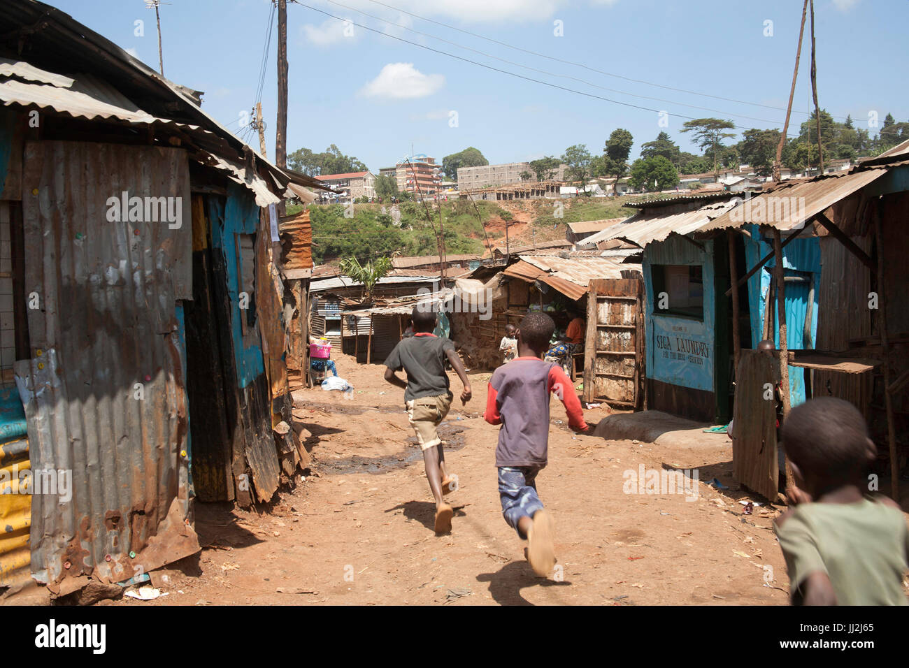 Kids running though the streets of Kibera slum, Nairobi, Kenya, East ...