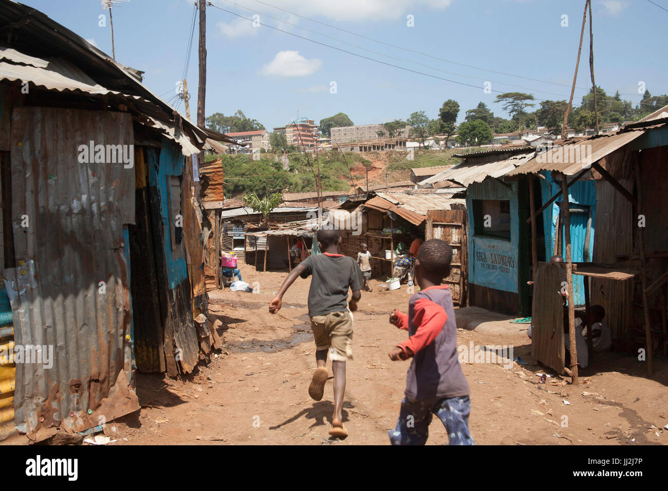 Kids running though the streets of Kibera slum, Nairobi, Kenya, East ...