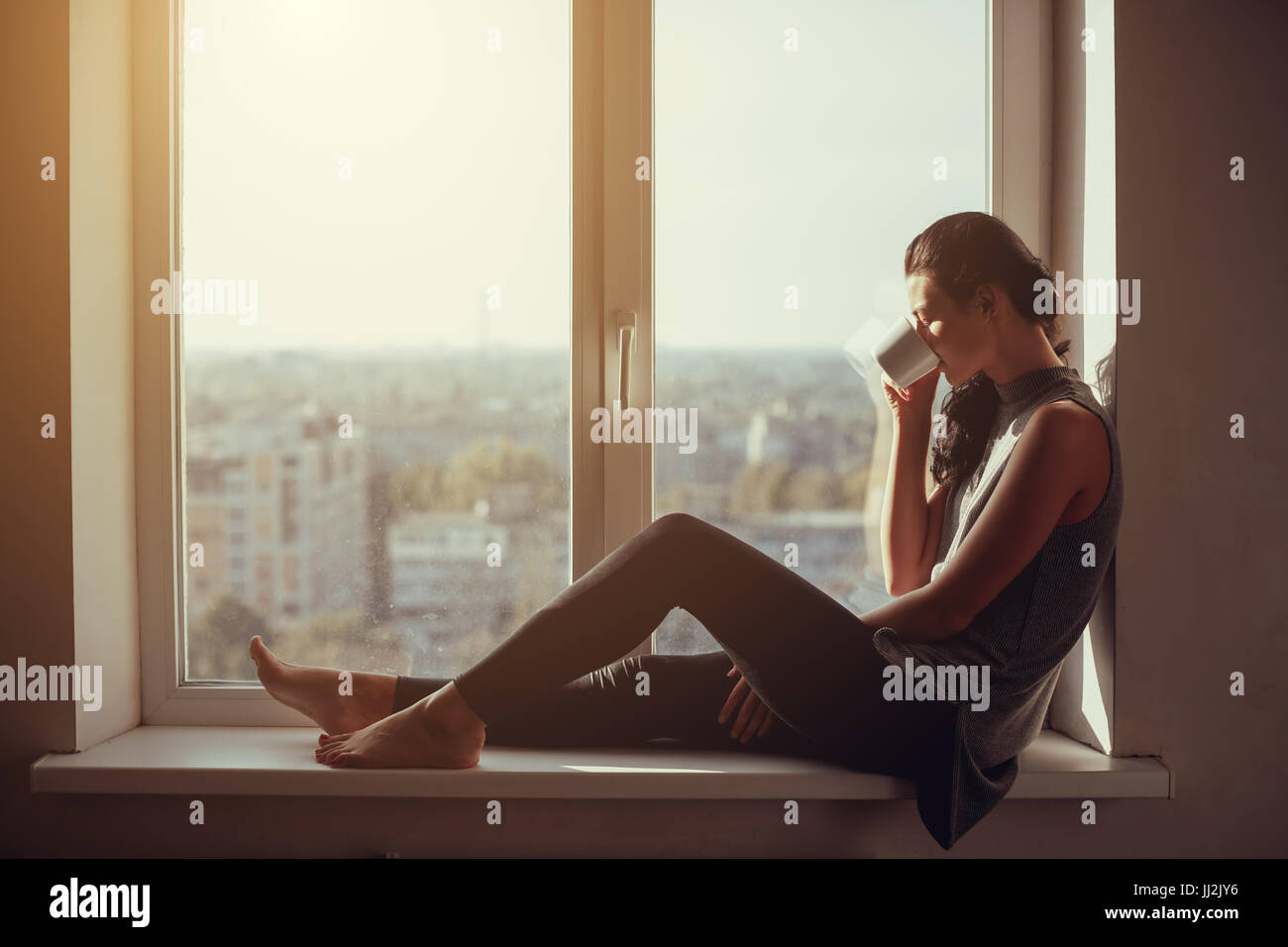 Girl resting and thinking at home Stock Photo - Alamy
