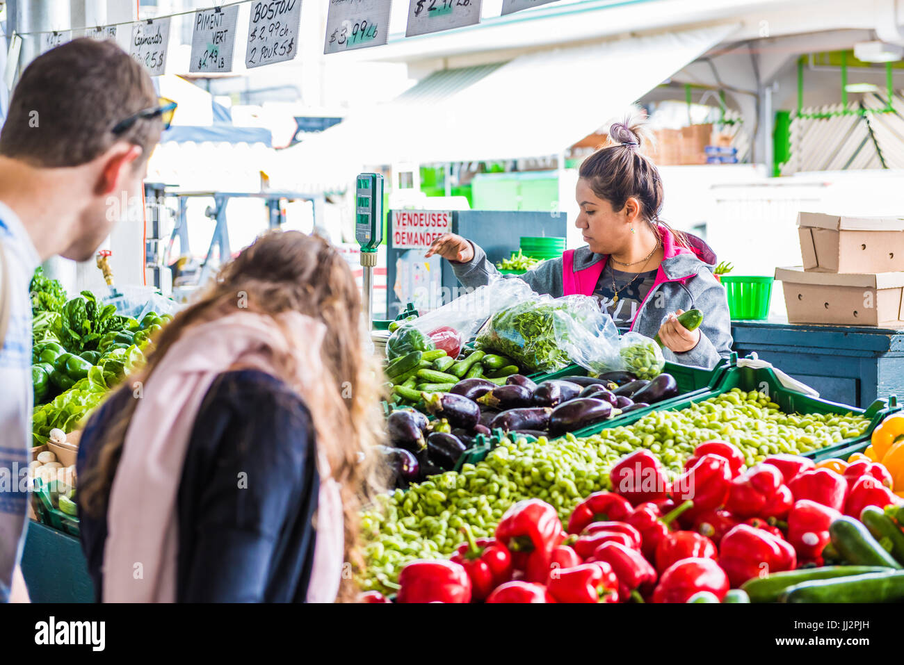 Montreal, Canada - May 27, 2017: Woman selling produce by vegetable ...