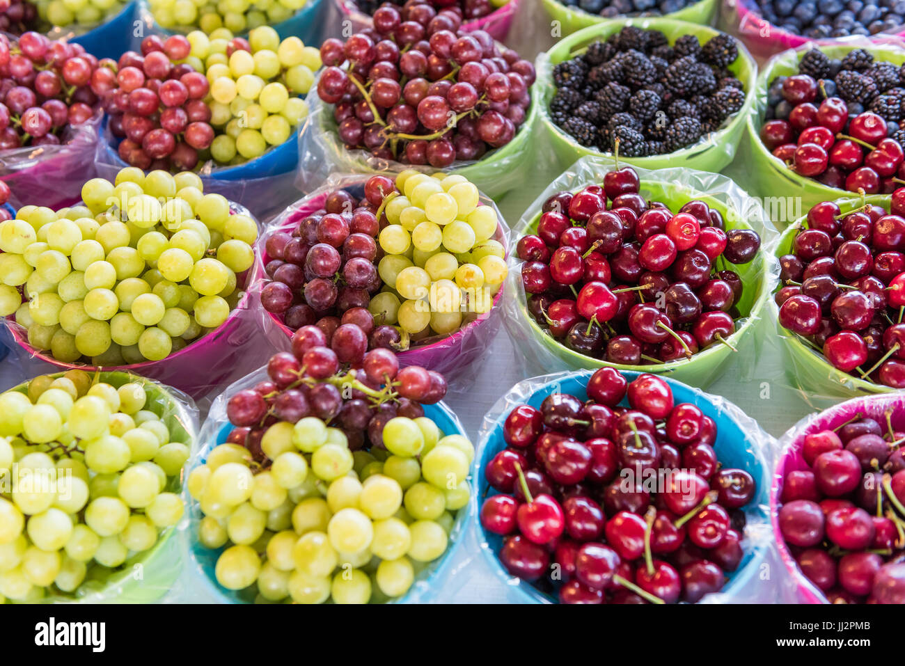 Fresh on the vine green and red seedless grapes, and cherries on ...