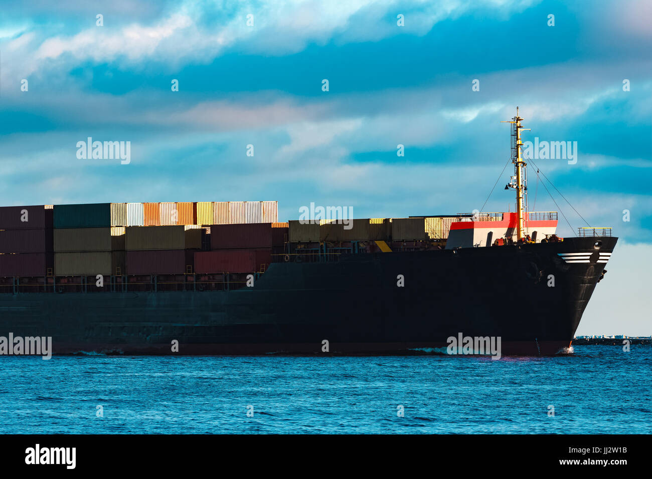 Modern black container ship moving from Baltic sea Stock Photo - Alamy