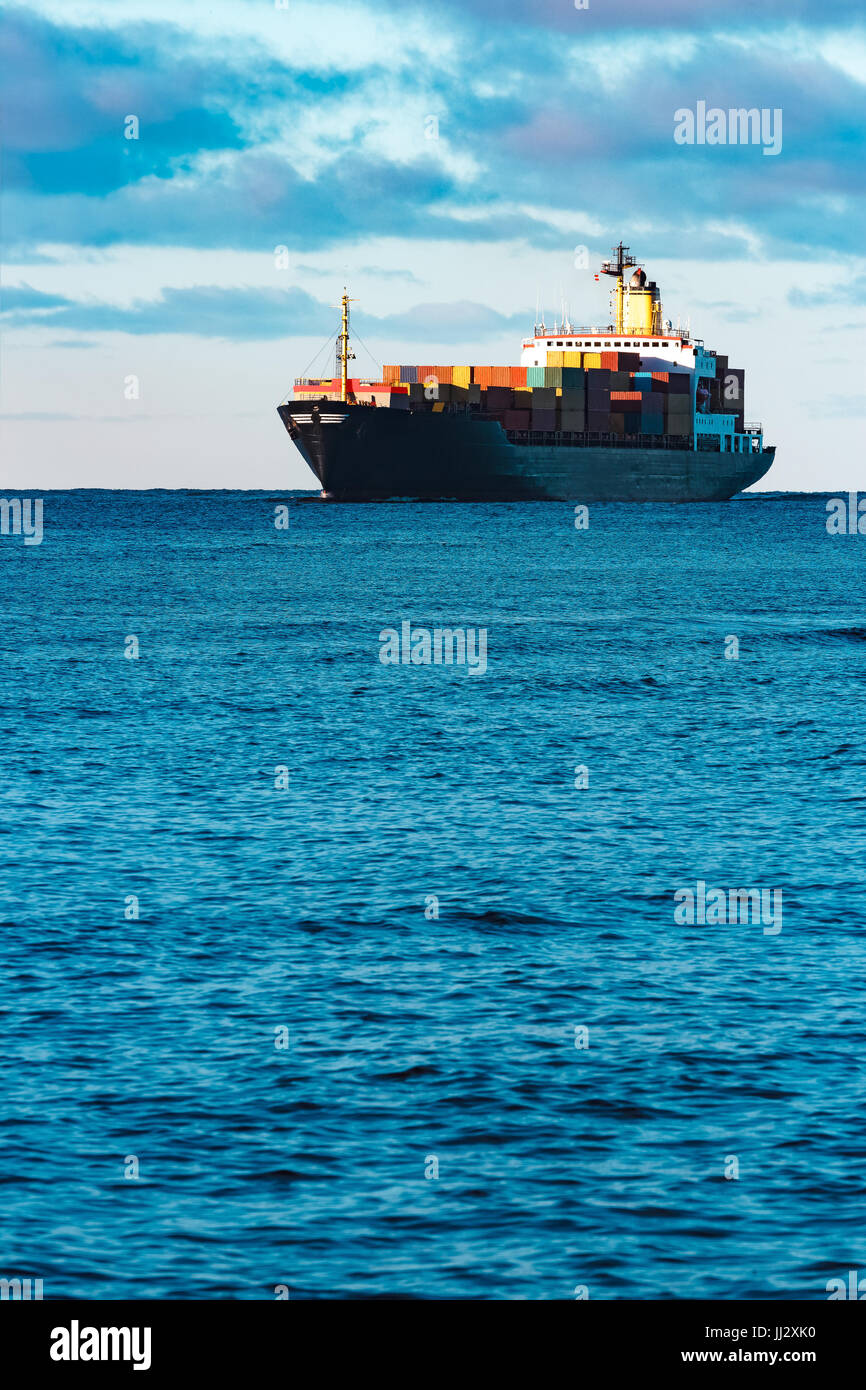 Modern black container ship moving from Baltic sea Stock Photo - Alamy