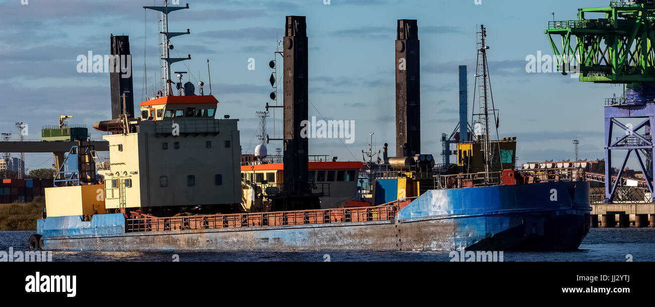 Blue cargo ship in the port of Riga, Europe Stock Photo - Alamy
