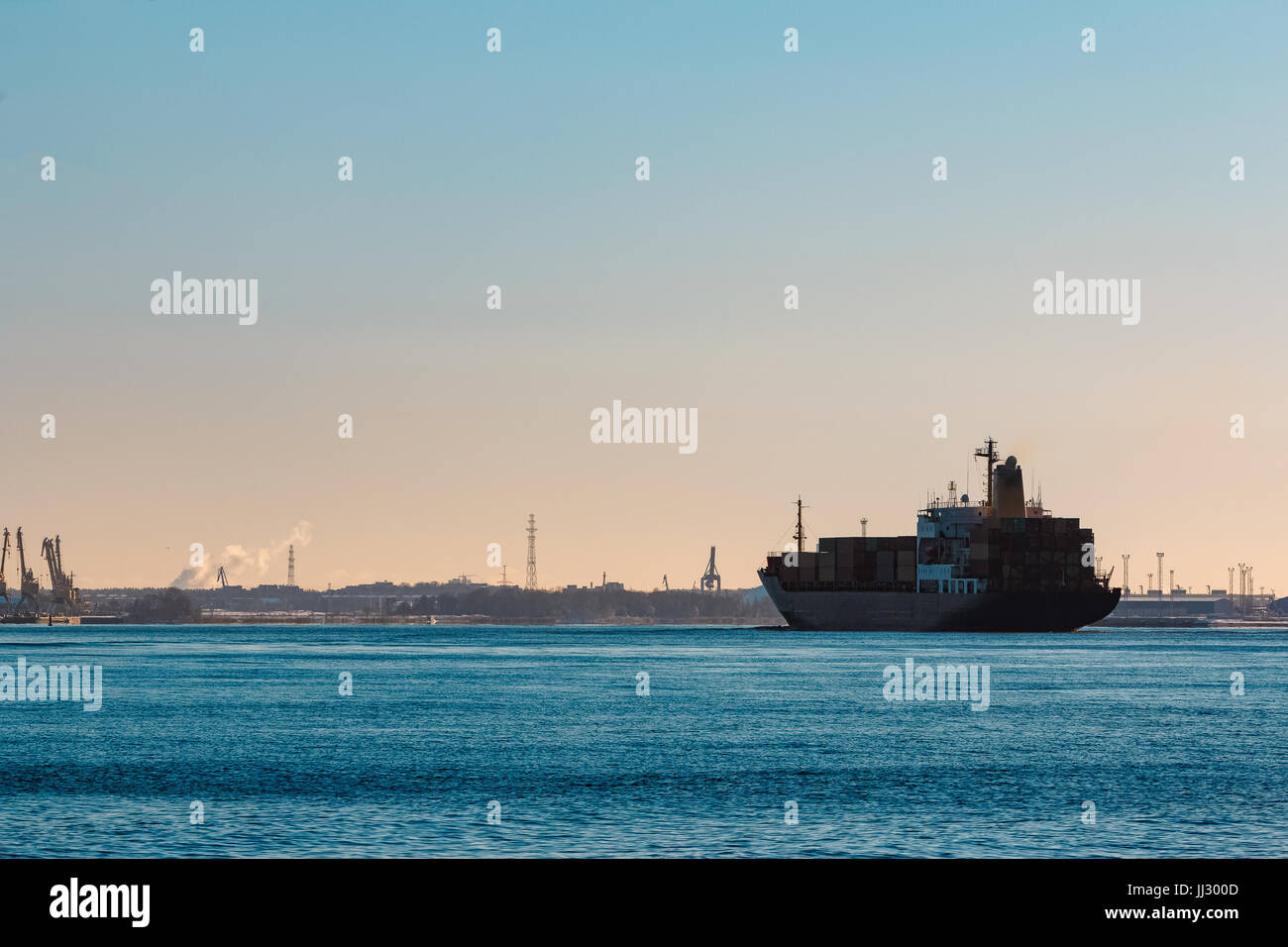 Modern black container ship moving from Baltic sea Stock Photo - Alamy