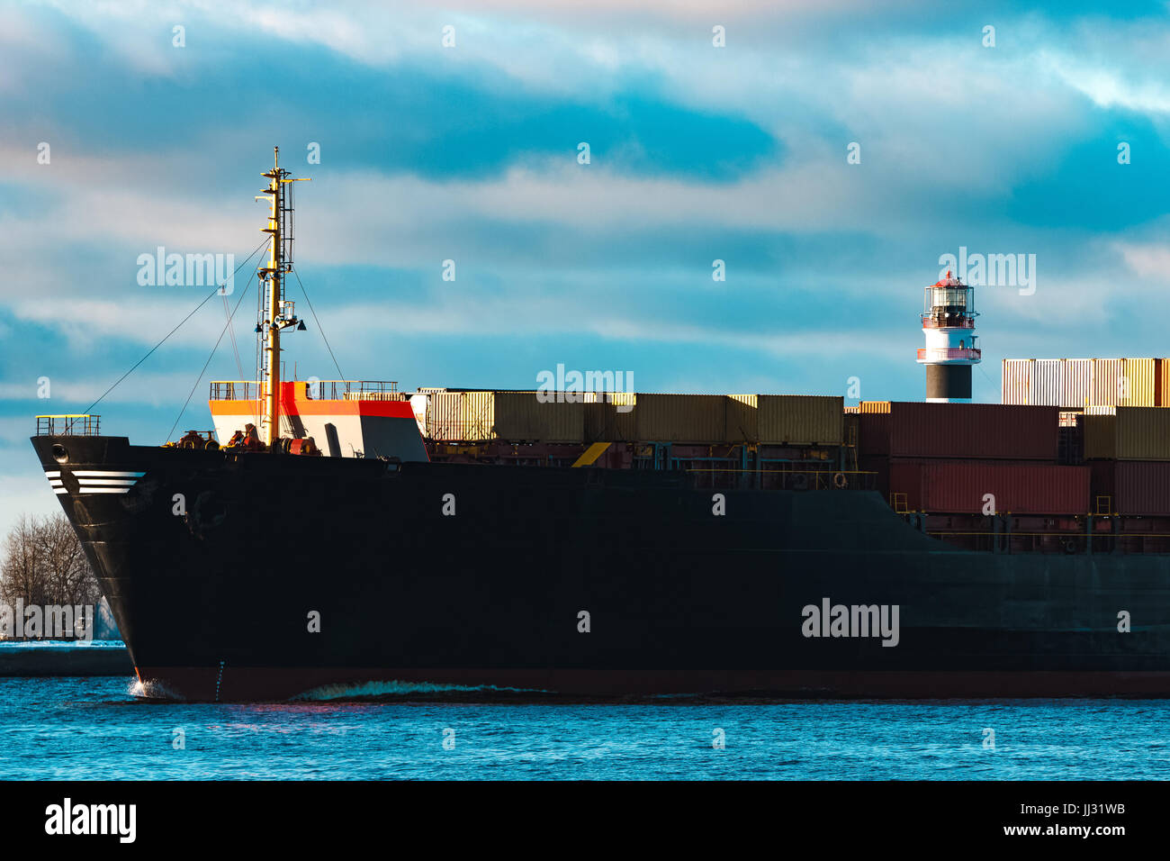 Modern black container ship moving from Baltic sea Stock Photo - Alamy