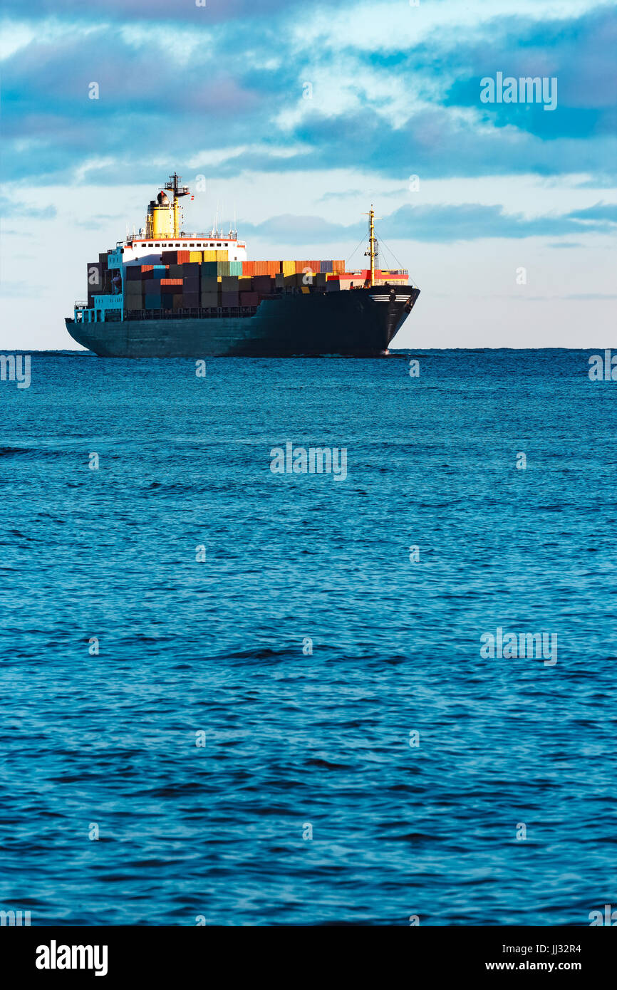 Modern black container ship moving from Baltic sea Stock Photo - Alamy