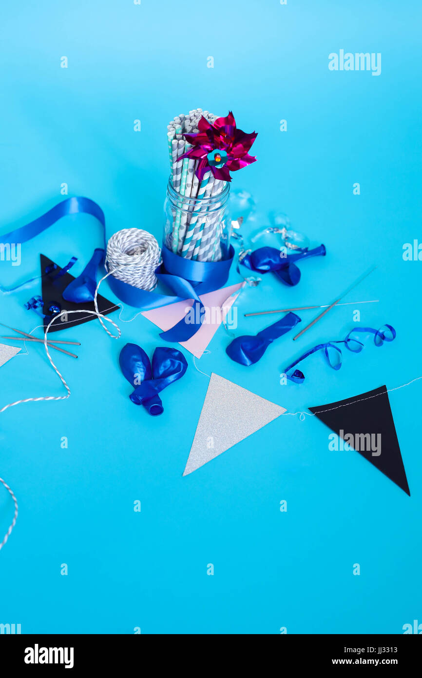 Festive. Party objects on a blue background Stock Photo - Alamy