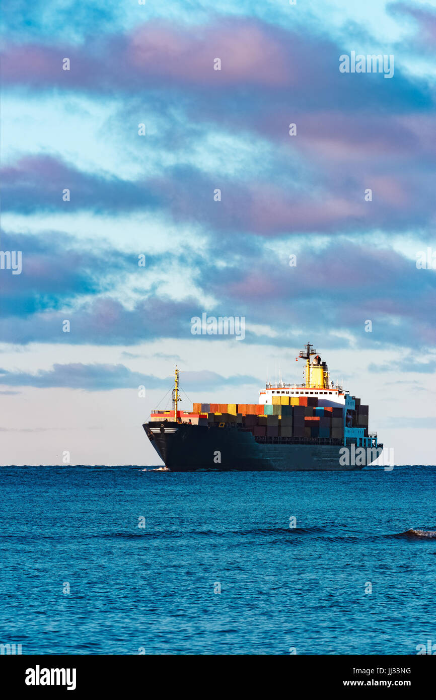 Modern black container ship moving from Baltic sea Stock Photo - Alamy