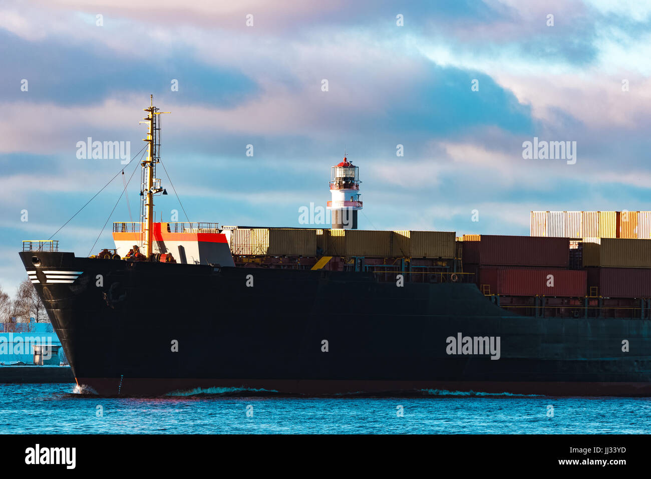 Modern black container ship moving from Baltic sea Stock Photo - Alamy