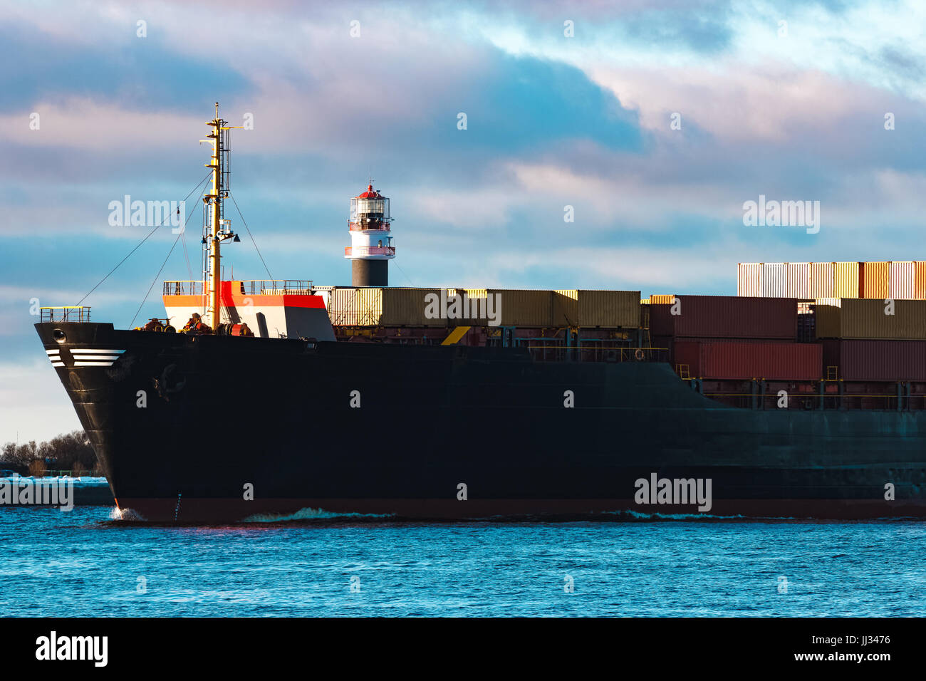 Modern black container ship moving from Baltic sea Stock Photo - Alamy