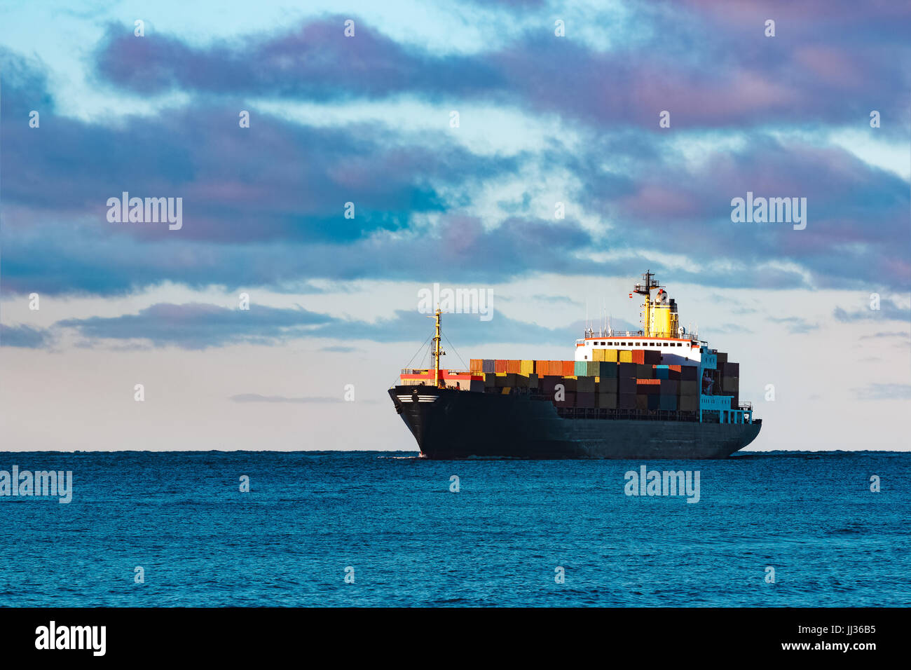 Modern black container ship moving from Baltic sea Stock Photo - Alamy