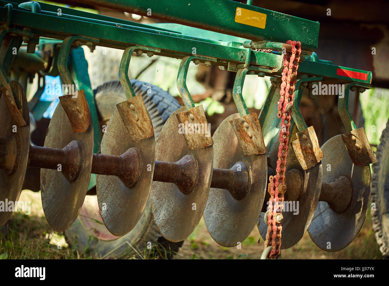 Discs of a harrowing agricultural machinery outdoor with selective ...