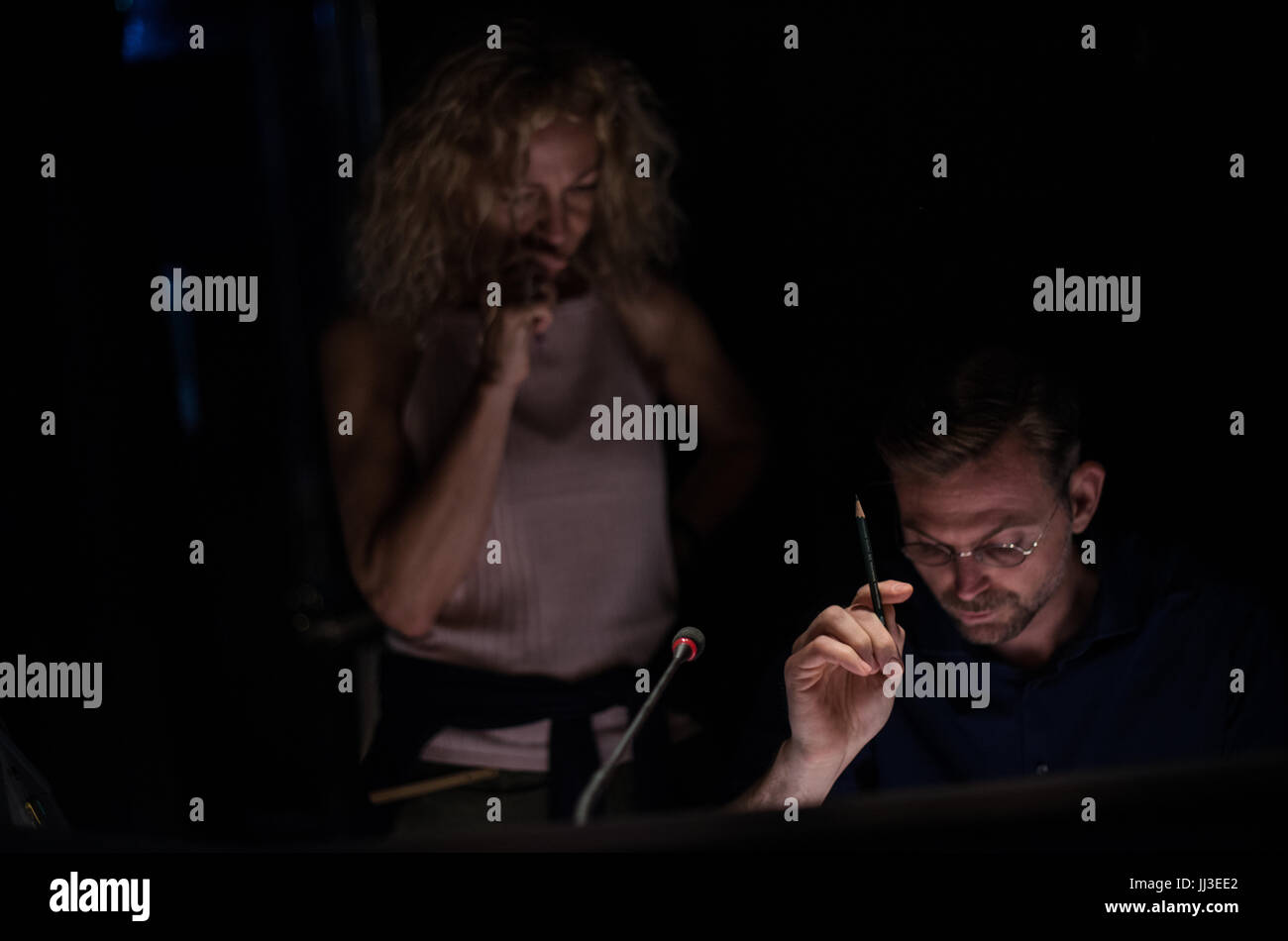 Kenneth Pettitt (R) talks to director Iris Limbarth about the staging ...