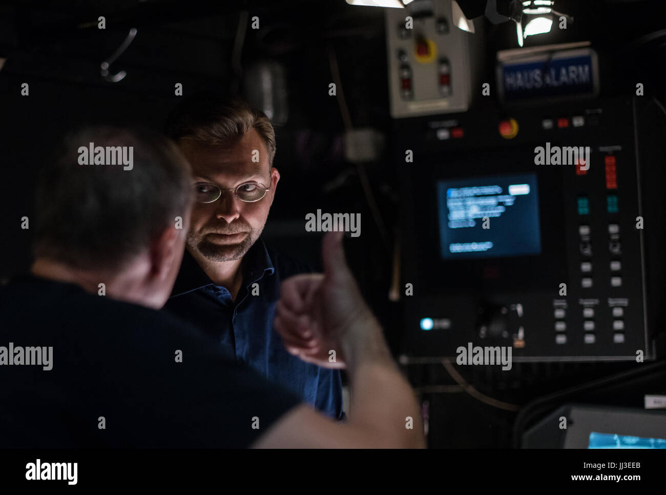 Kenneth Pettitt (R) talks to a colleague about the staging of 'Jesus ...