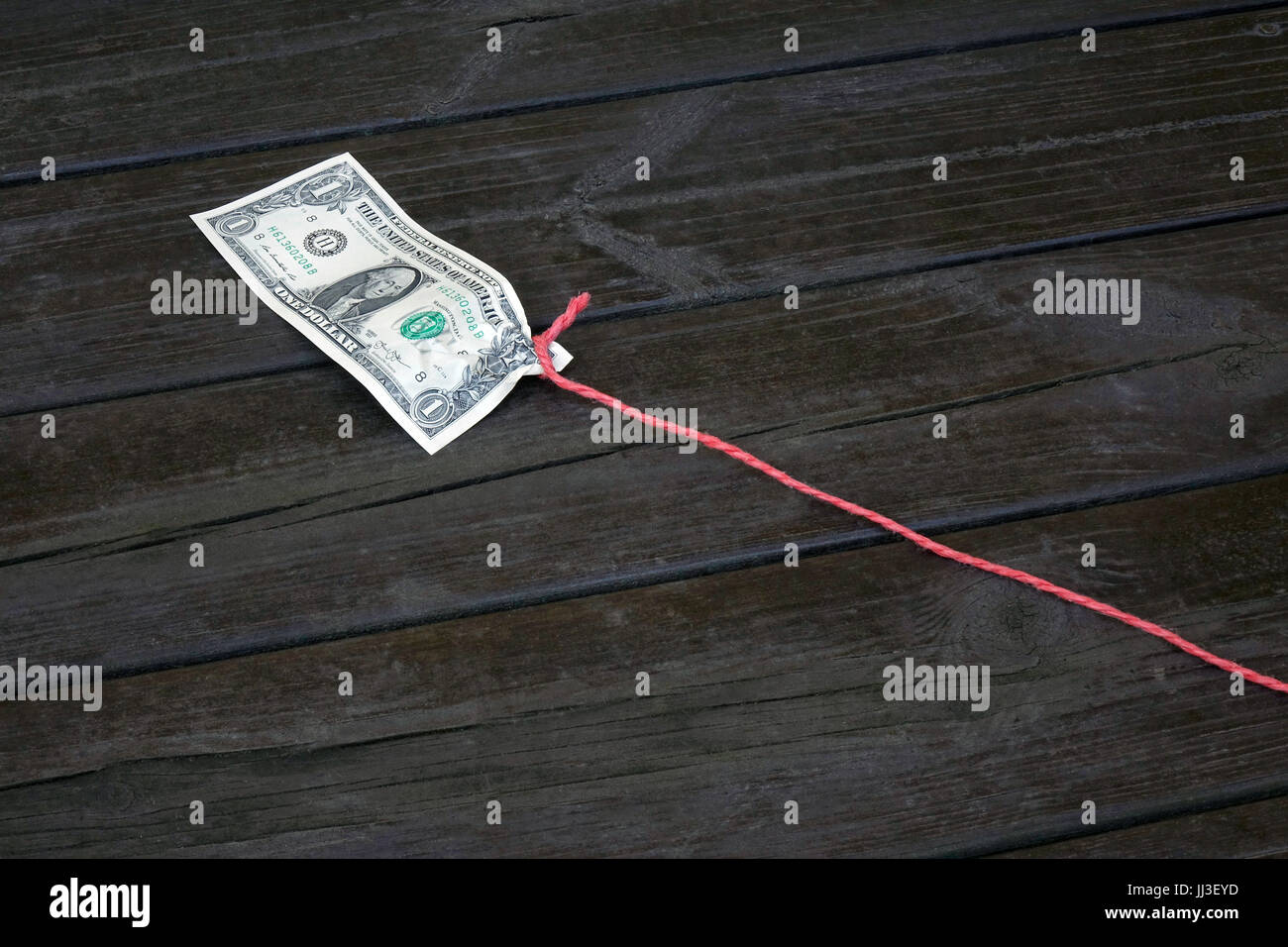 Berlin, Germany. 23rd Mar, 2017. ILLUSTRATION - A one-dollar bill is ...