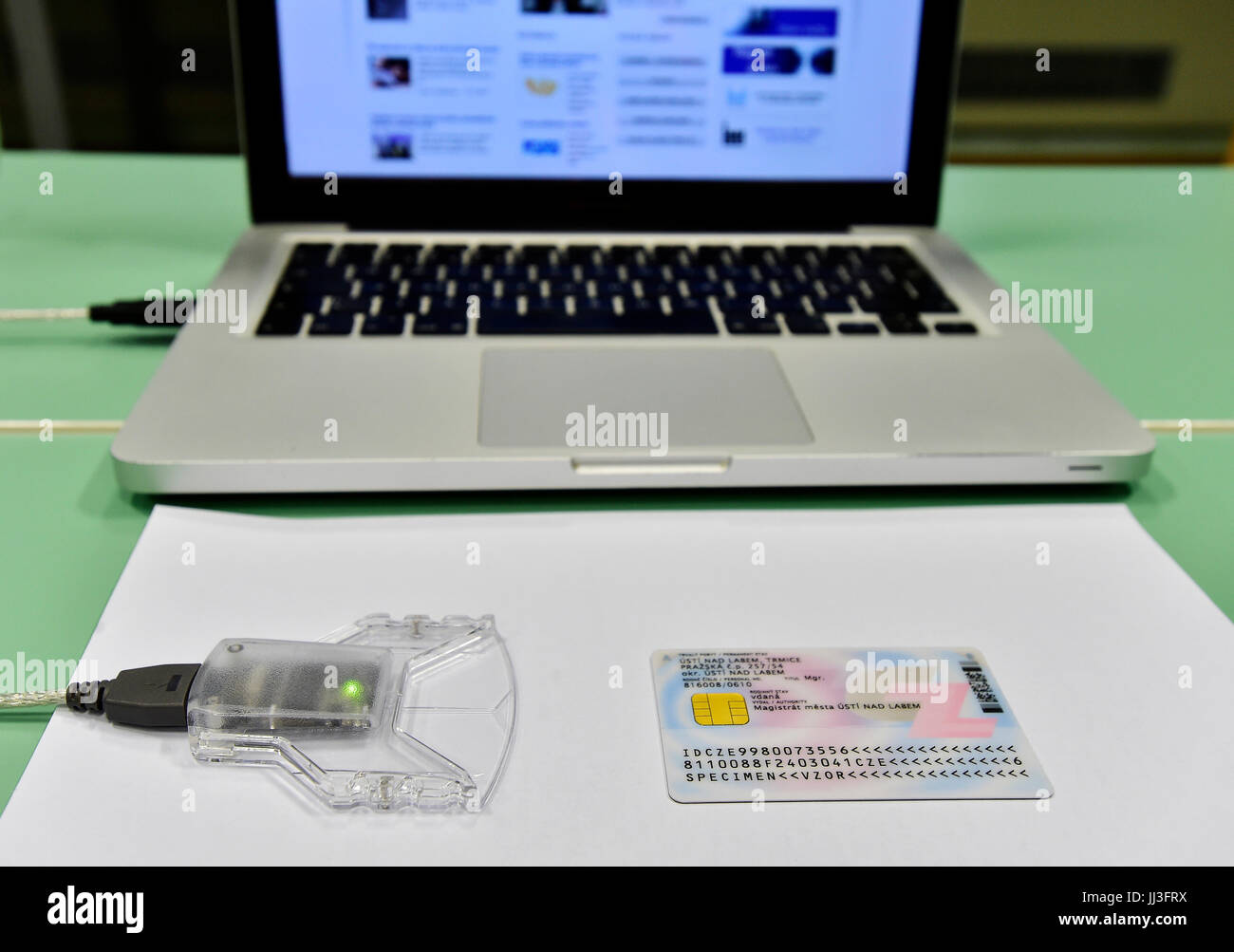 The new ID card with chip and reader was introduced during the press ...