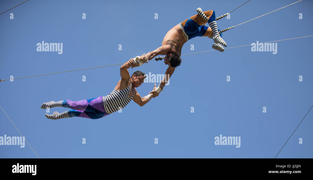Trapeze artist David Ponce and catcher Antoly Huaman pair for a triple ...