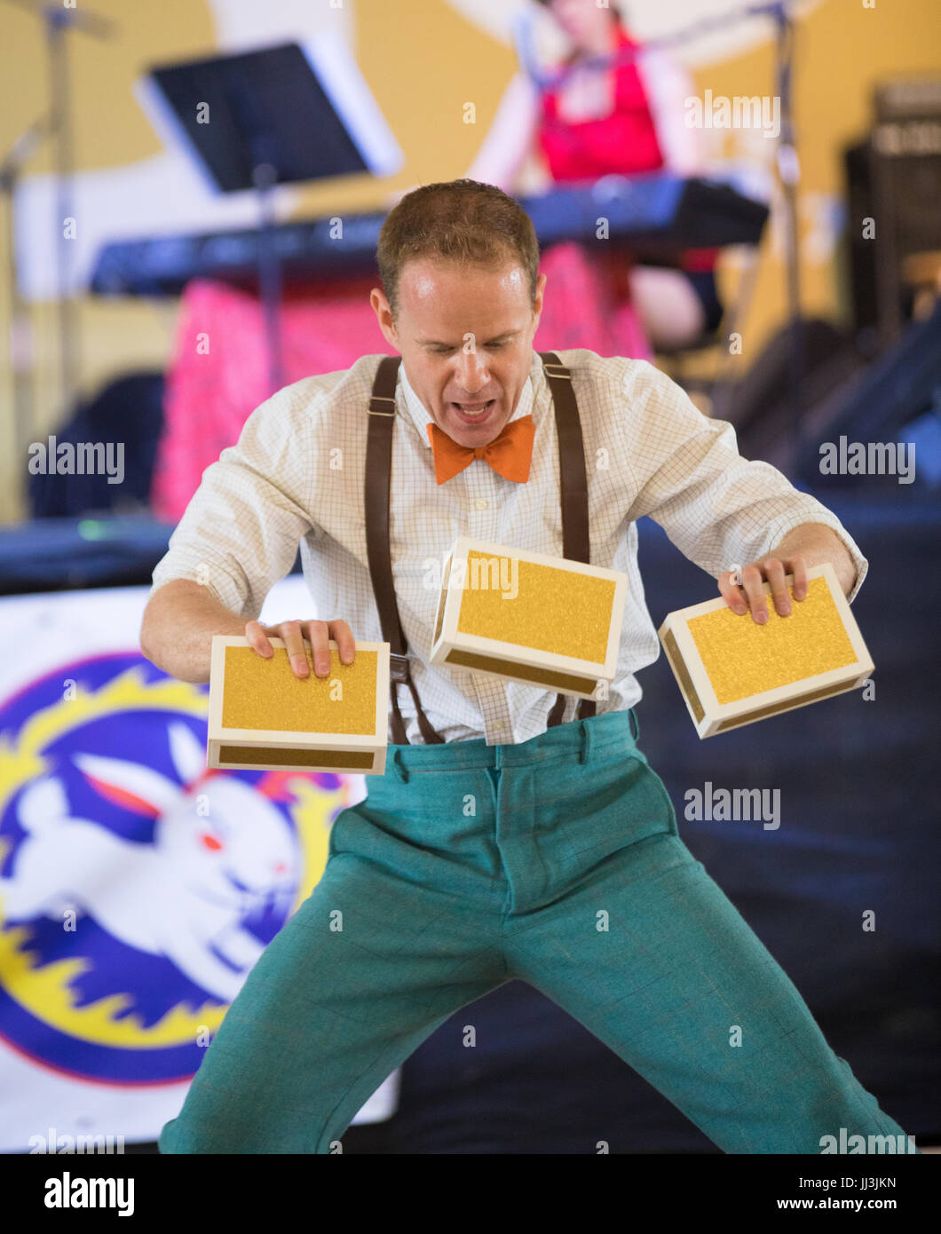 Adam Kuchler juggling and stacking cigar boxes performs for the ...