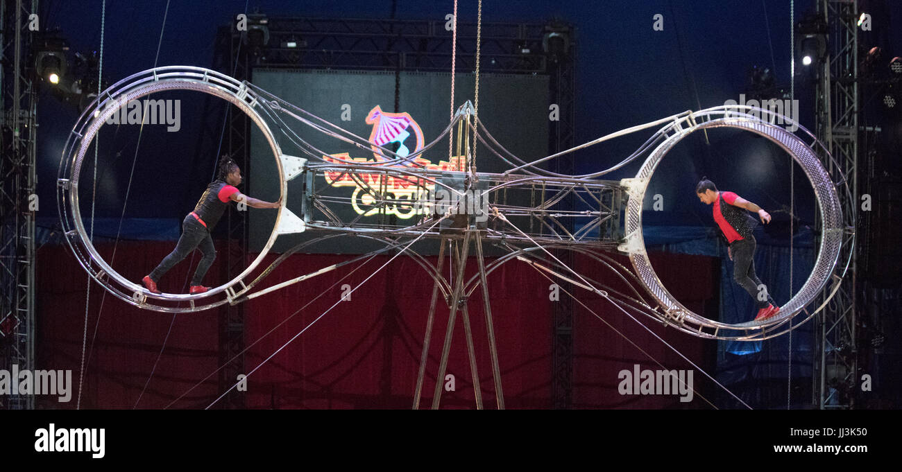 Acrobats perform on the "Wheel of Death" with the UniverSoul Circus ...
