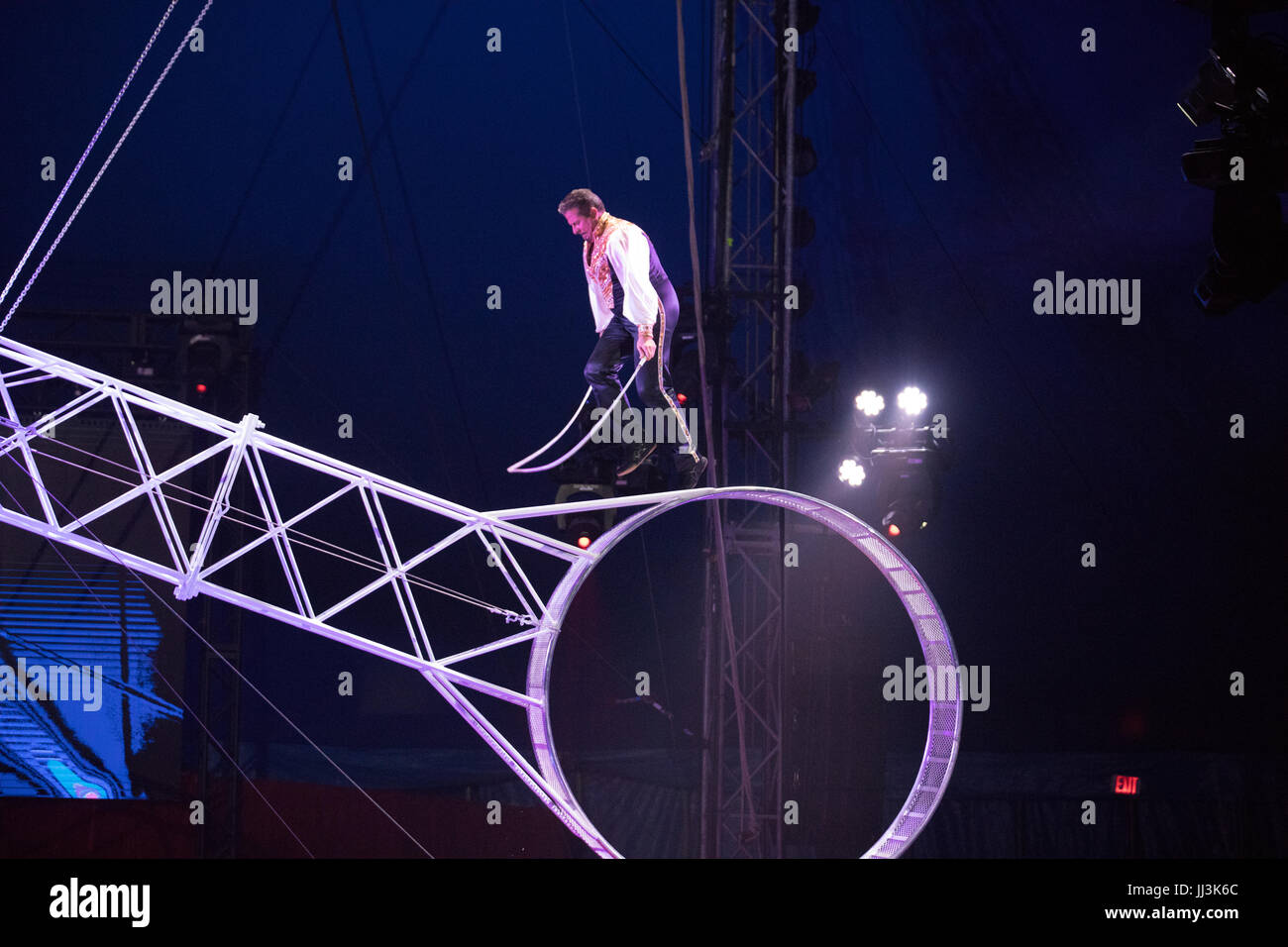 Joseph Dominic Bauer demonstrates his acrobatic skills on the "wheel of ...
