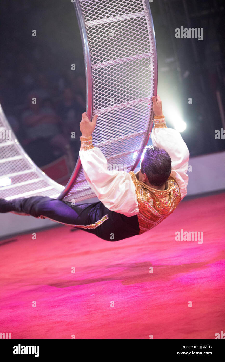 Joseph Dominic Bauer demonstrates his acrobatic skills on the "wheel of ...