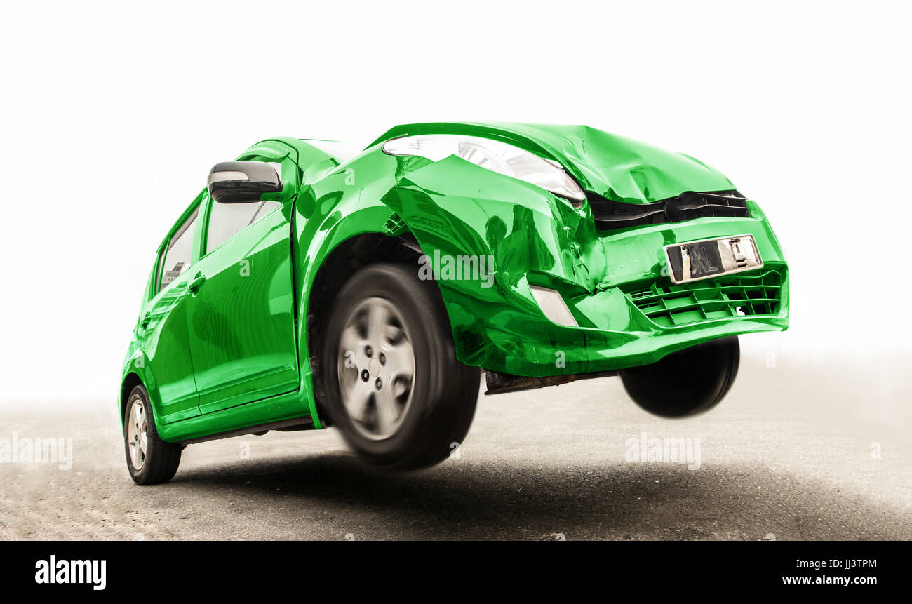 The green car on the road has damaged the front. Traffic accident of a ...