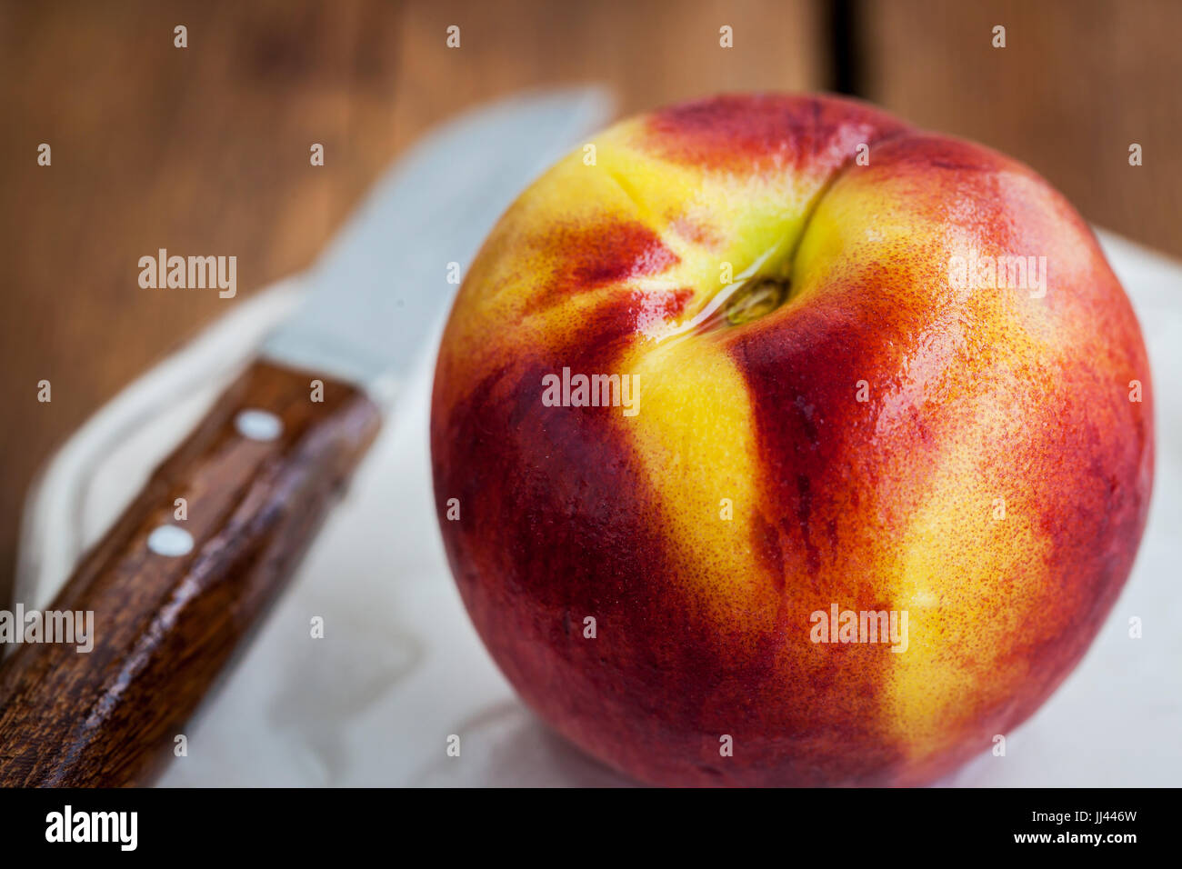 Fresh ripe wet peach on plate, wooden background Stock Photo - Alamy