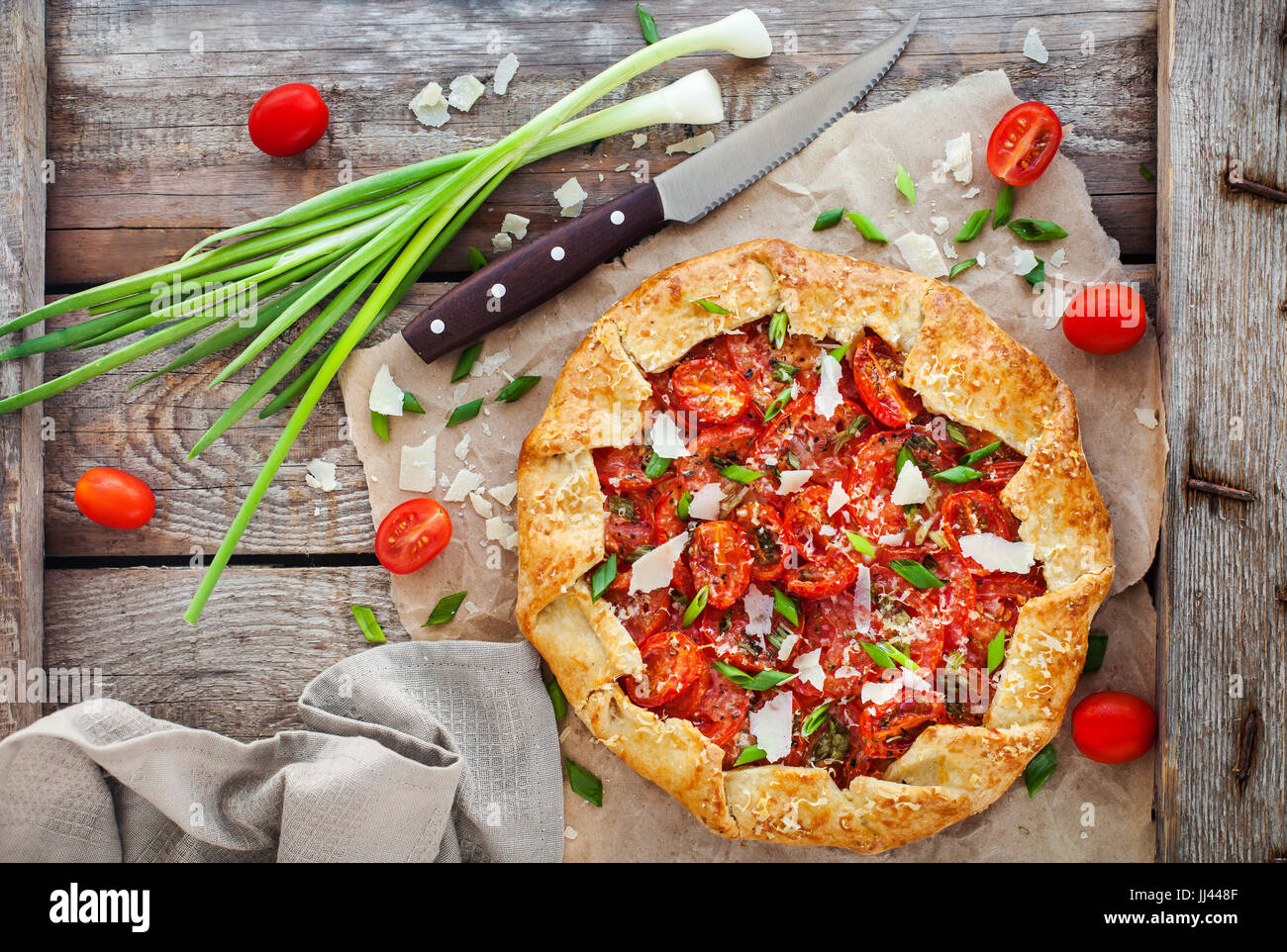 Delicious homemade rustic open pie (galette) with tomato, cheese and ...