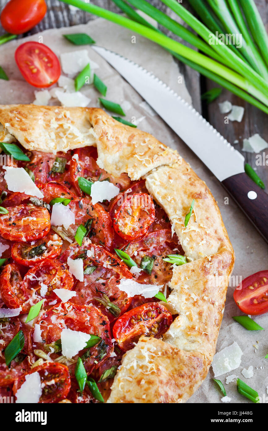 Delicious homemade rustic open pie (galette) with tomato, cheese and ...