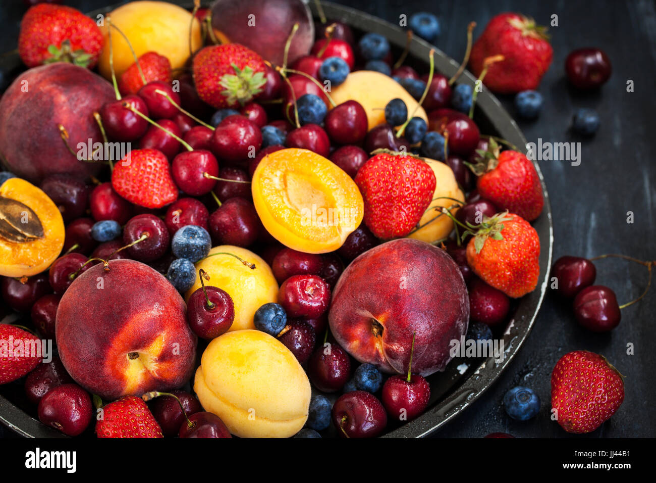 Fresh Ripe Summer Berries And Fruits Peaches Apricots Cherries And