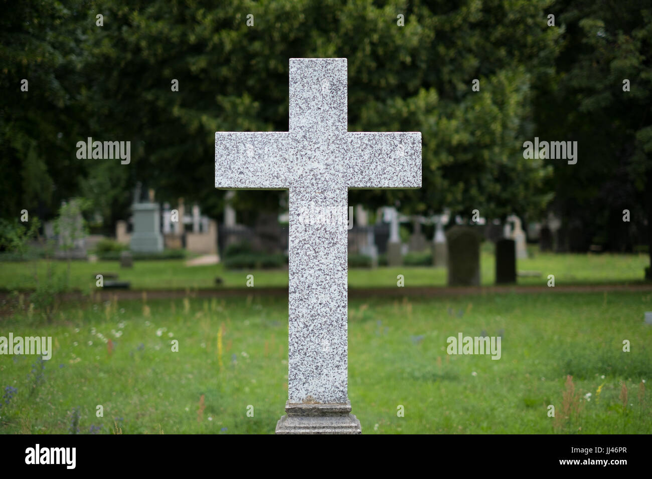 Stone cross gravestones on cemetery / graveyard Stock Photo - Alamy