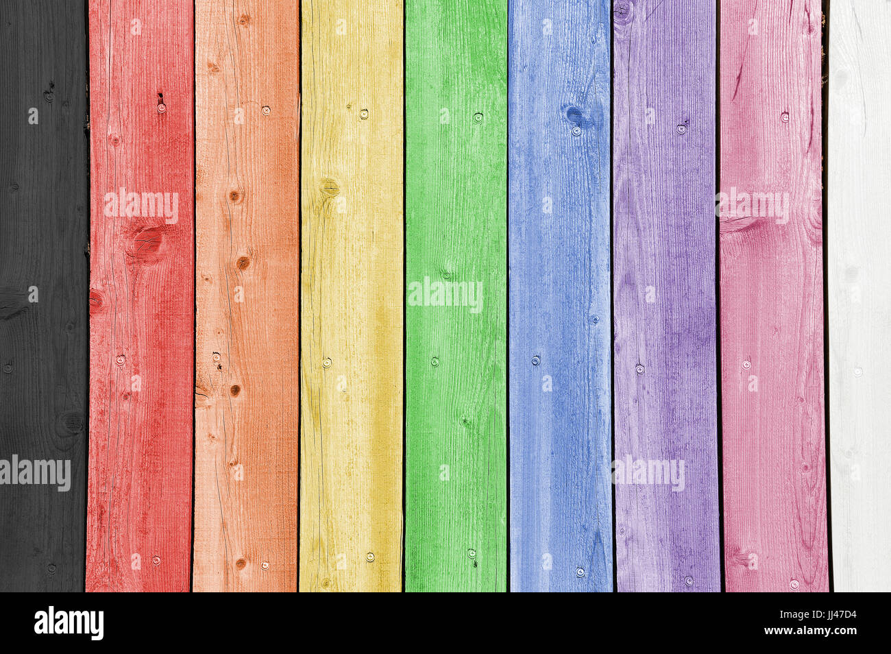 Nine rainbow colored timber planks screwed down in a row Stock Photo ...