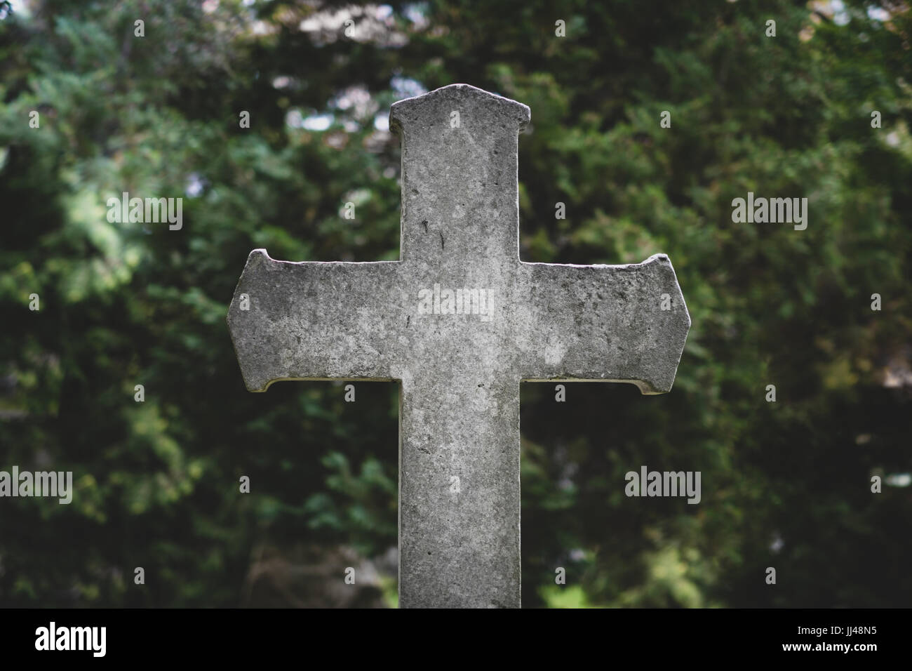 Stone cross gravestones on cemetery / graveyard Stock Photo - Alamy