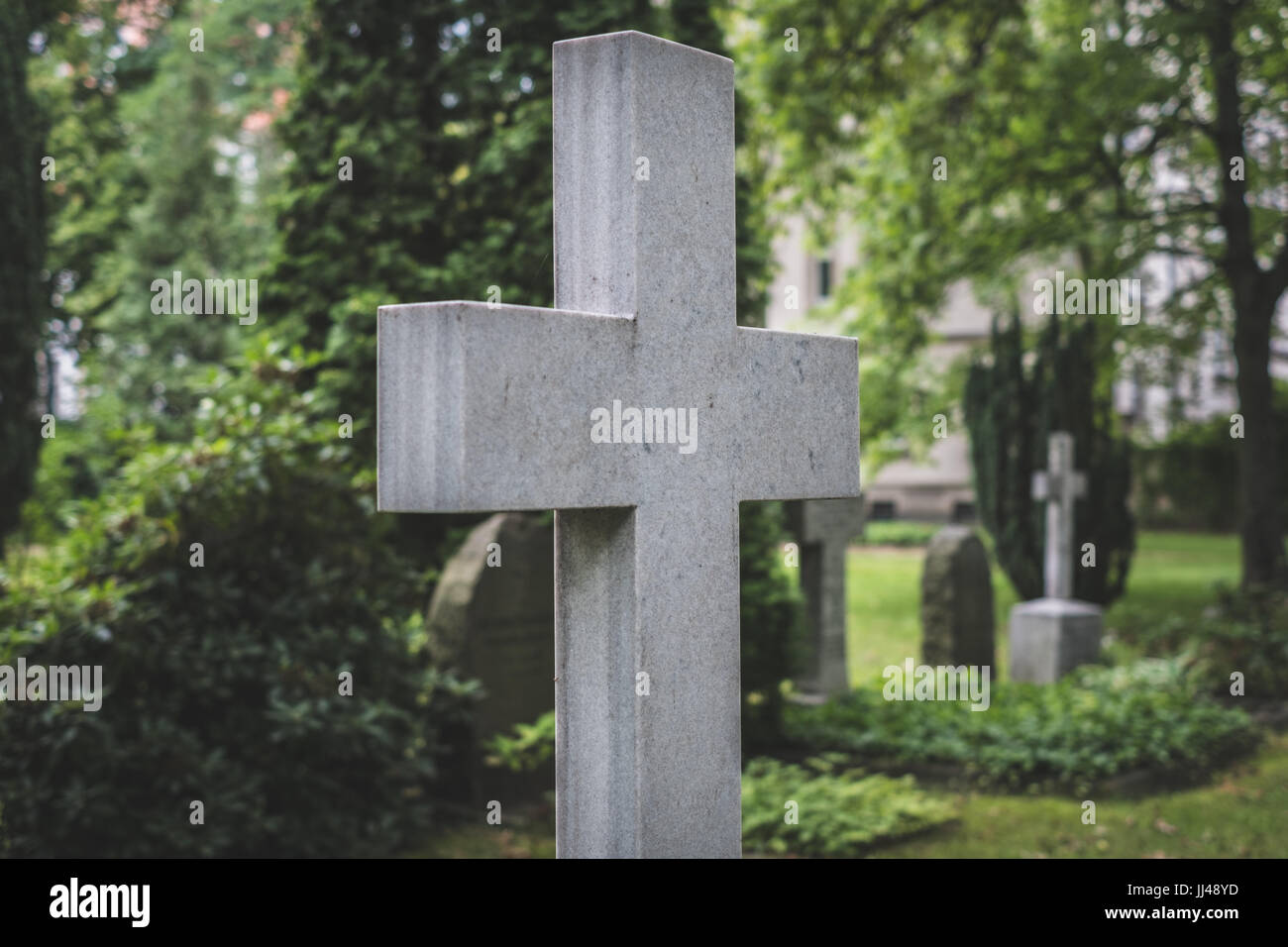 Stone cross gravestones on cemetery / graveyard Stock Photo - Alamy