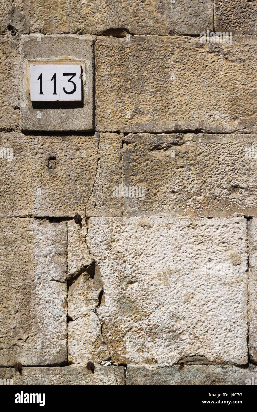 Old street number 113 on stone building in Pisa, Italy Stock Photo - Alamy