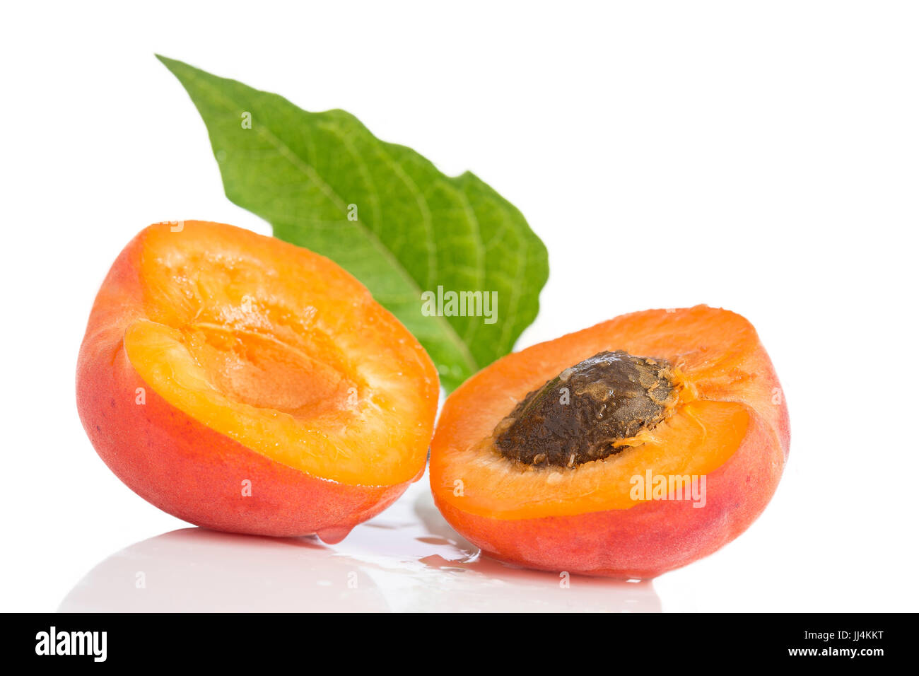 halved apricot with stone inside Stock Photo - Alamy