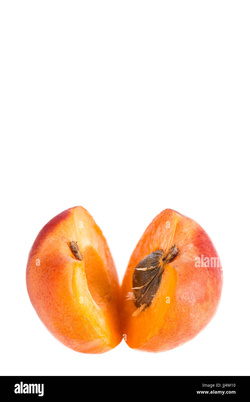 halved apricot with stone inside Stock Photo - Alamy