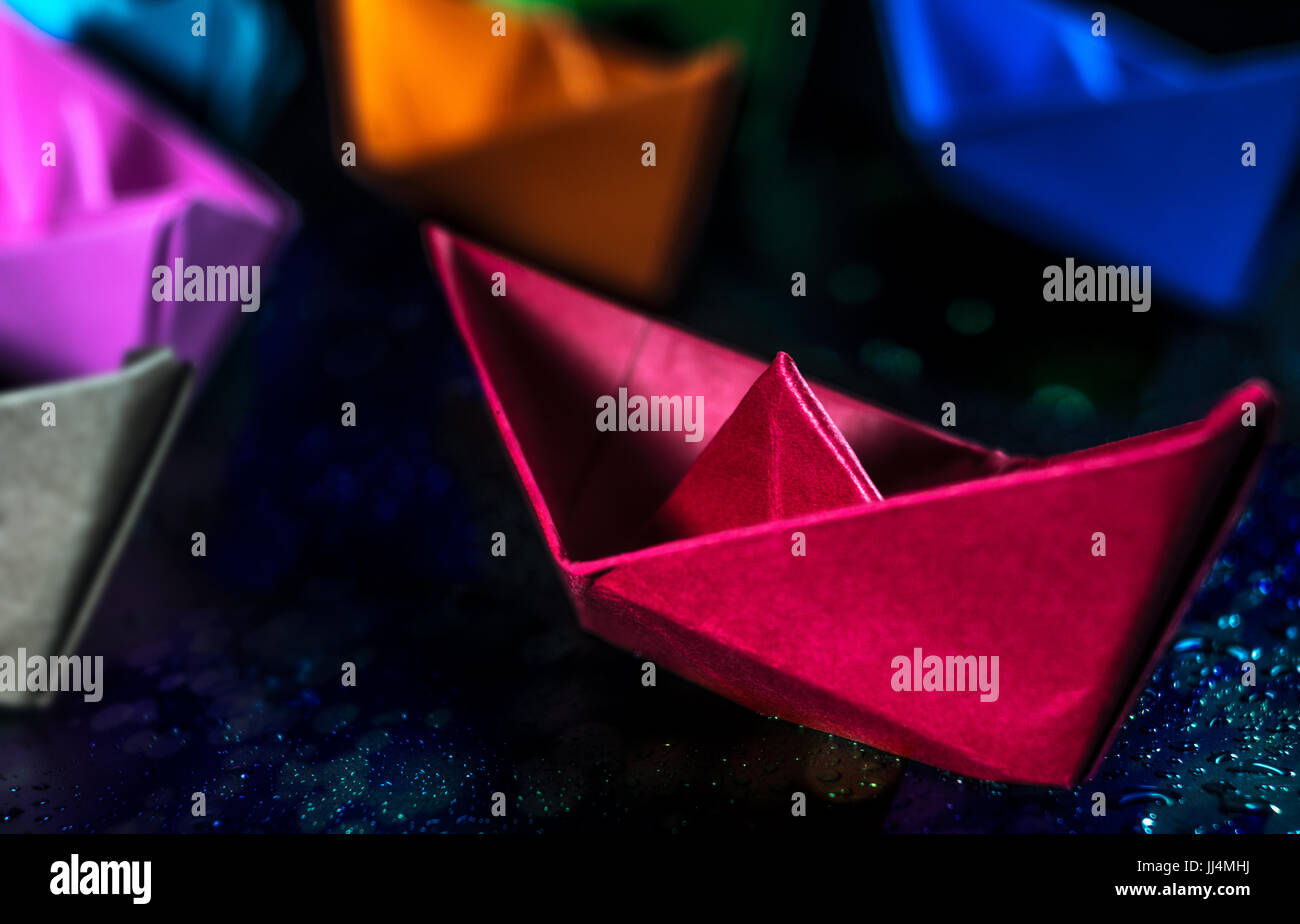 Colored paper boats Stock Photo - Alamy